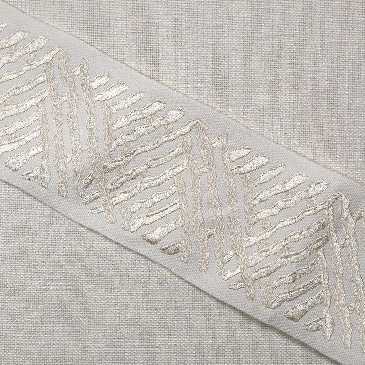 11456 | Trelli Emb Tape Pearl - Mag Fabric